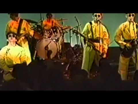 Mongoloid by Devo Lyrics Meaning - Piercing the Veil of Normalcy in ...